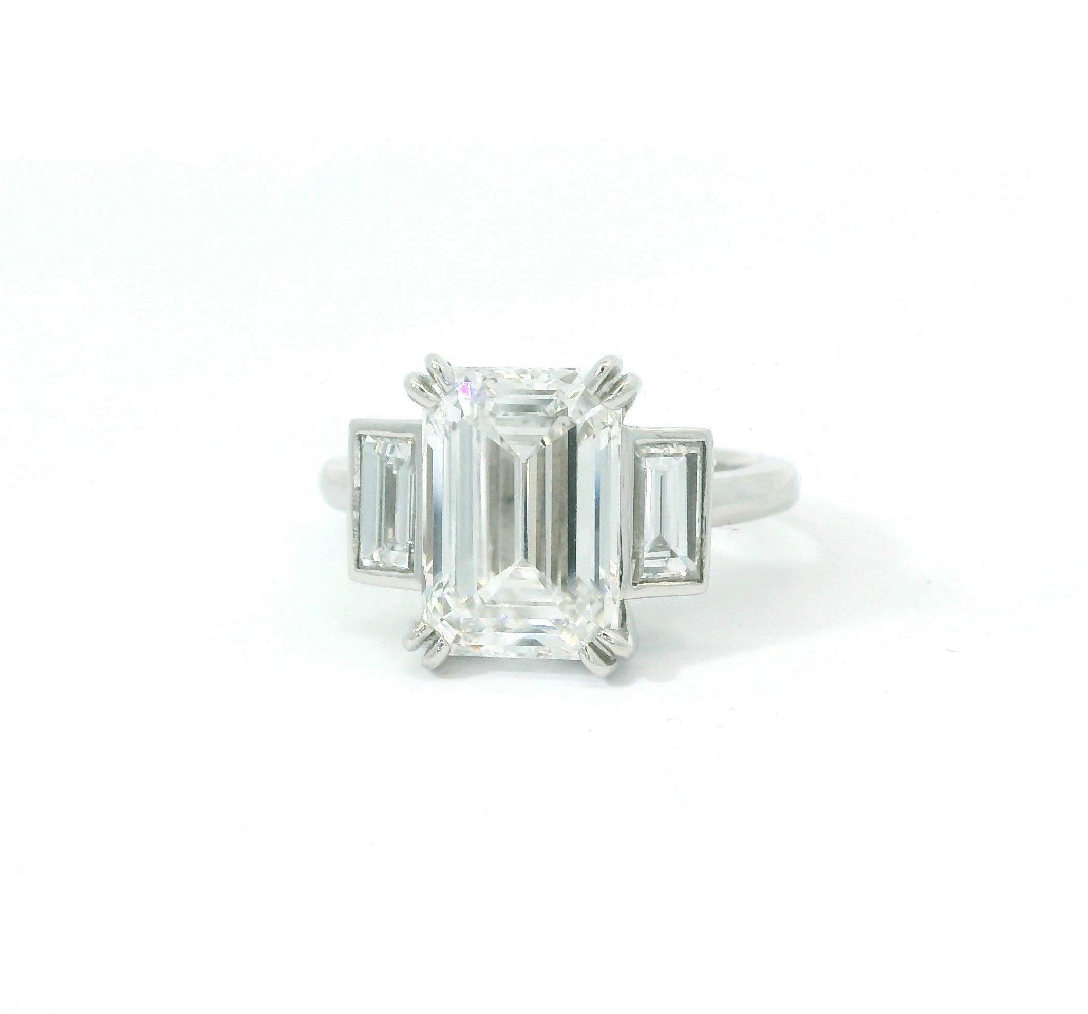 Platinum set Emerald cut Diamond Trilogy Ring. – Desma Designs